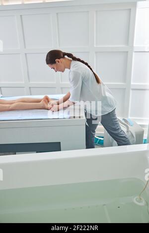 Woman making foot massage indoors, closeup Stock Photo - Alamy