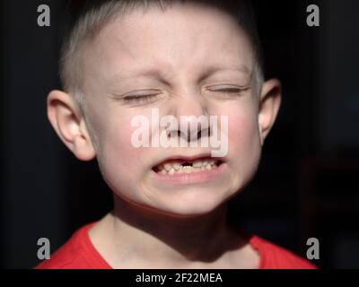 A small child without front teeth laughs merrily Stock Photo - Alamy
