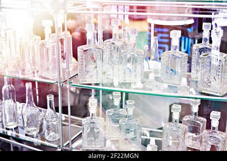 Empty bottles for alcoholic drinks at a shop window Stock Photo - Alamy