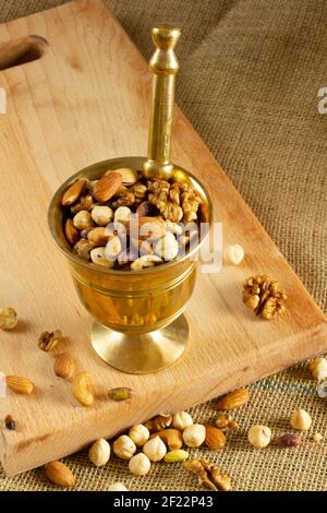 mixed nuts morter and pestle Stock Photo - Alamy