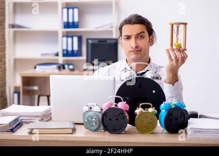 Young employee afraid of missing deadline at workplace Stock Photo - Alamy
