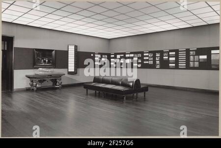 Room with information panels on the wall and visitors; Educational ...