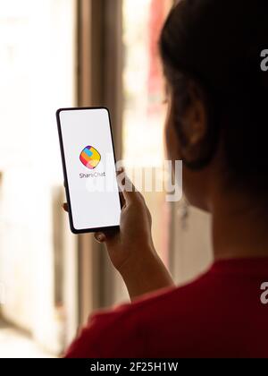 ShareChat logo on the App Store displayed on a phone screen and ...