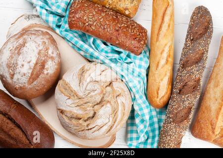 Various crusty bread and buns cooking. Top view Stock Photo - Alamy