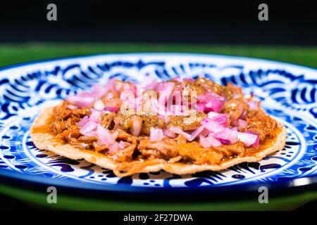tostada, typical Mexican dish, made from cochinita pibil Stock Photo ...