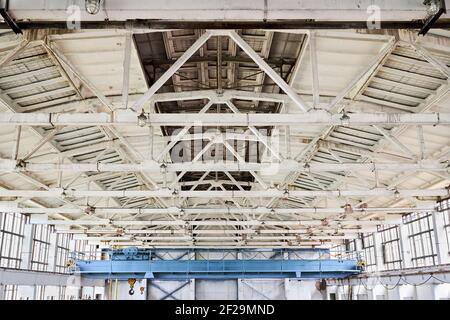Overhead crane inside industrial building. Bridge crane inside hangar ...