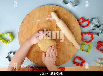 Dough and christmas cookie. Children making christmas cookies in the ...