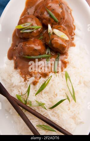 honey garlic meatballs with vegetables and white rice Stock Photo - Alamy