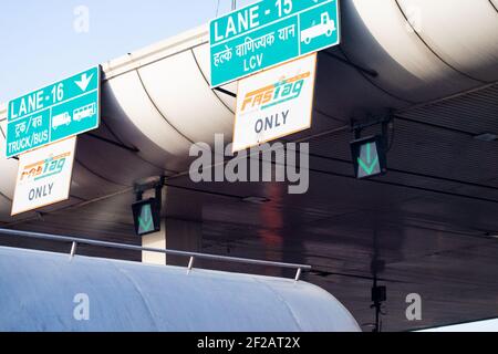 Toll booth sign near a toll booth showing the new cashless RFID based ...