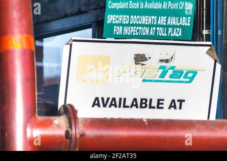 Toll booth sign near a toll booth showing the new cashless RFID based ...