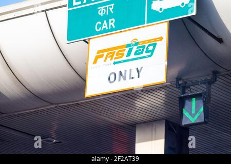 Fast Tag sign near a toll booth showing the new cashless RFID based ...
