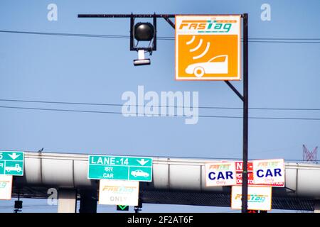 Toll booth sign near a toll booth showing the new cashless RFID based ...