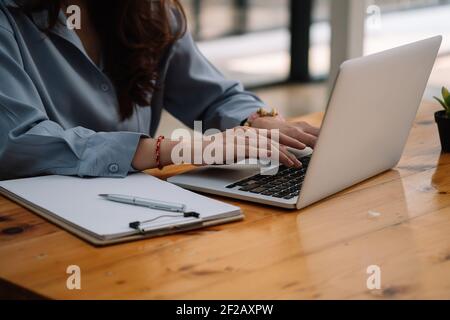 Student comparing notes online with a laptop in the night at home Stock ...