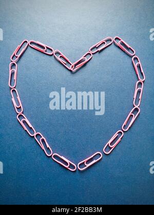 Paper clips arranged in heart shapes isolated on white background Stock ...