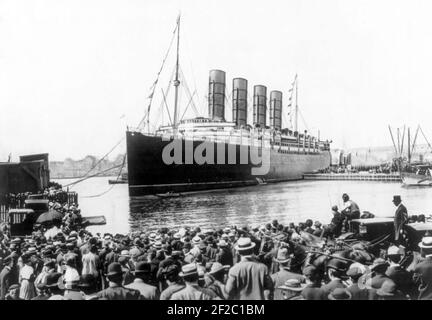 A photograph of the RMS Lusitania in New York City, showing its bow ...