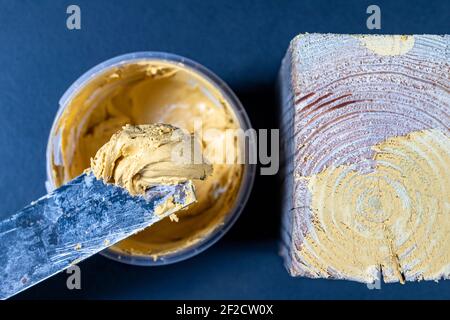 Filling raw wood in a workshop. Small carpentry work. Light background ...