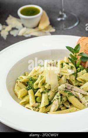 A Bowl of Penne Pasta with Pesto Sauce Stock Photo - Alamy