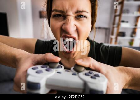 Female Gaming Addiction. Player With Console Controller Stock Photo - Alamy