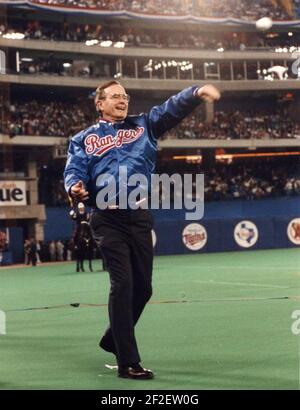 President George W. Bush throws out the ceremonial first pitch Tuesday ...