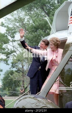Ronald Reagan and Nancy Reagan waving from the limousine during the ...