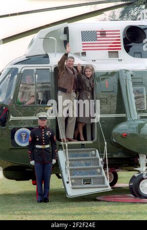 Ronald Reagan and Nancy Reagan waving from the limousine during the ...