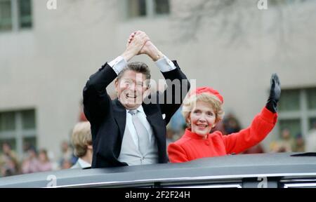 Ronald Reagan and Nancy Reagan waving from the limousine during the ...