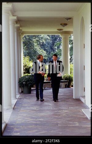 President Ronald Reagan walking and talking with Republican Senator ...