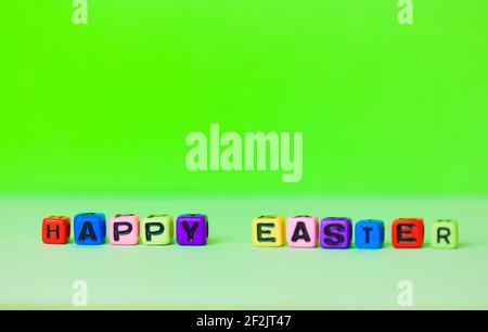 Easter multicolored word written with wooden alphabet letters on a ...