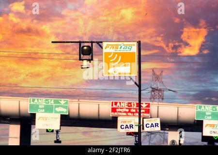 Toll booth sign near a toll booth showing the new cashless RFID based ...