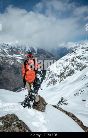 Man standing on mountain against sky Stock Photo - Alamy