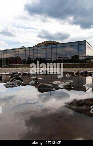 Centennial Hall reflected in puddle Stock Photo - Alamy