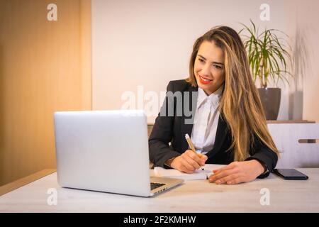 A Spanish businesswoman doing an online meeting during the pandemic ...