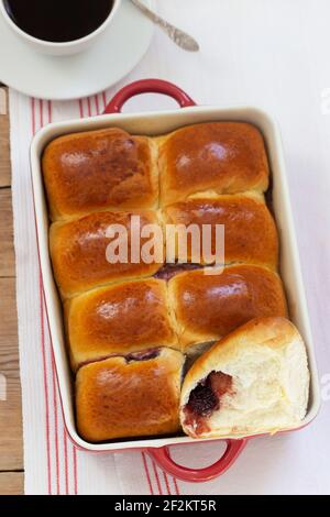 Austrian buns with cherry filling in a baking dish. Rustic style Stock ...