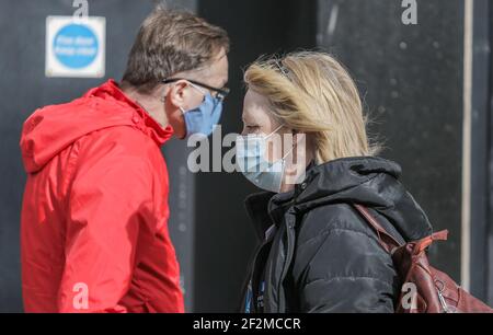 12th, March, 2021. Cheltenham, England. A member of the public walks ...