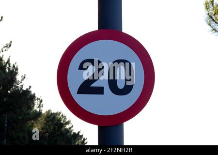 20 kph speed limit sign, with speed calming sign Stock Photo - Alamy