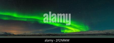 Northern lights glowing green, Abisko National Park, Sweden Stock Photo ...