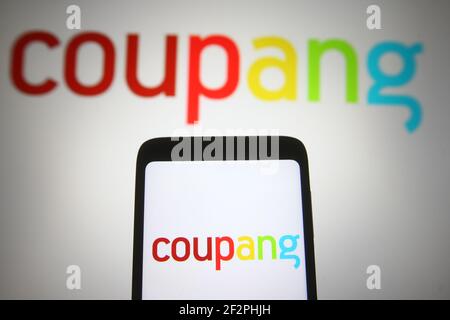 In this photo illustration, the Coupang logo is seen displayed on a ...