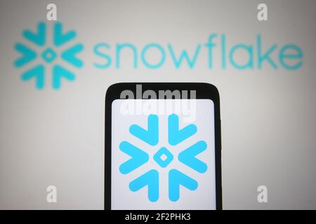 In this photo illustration, the Snowflake company logo is seen ...