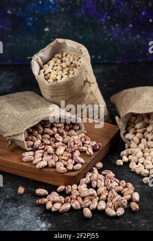 Sackcloth of dried raw beans placed on dark background Stock Photo - Alamy
