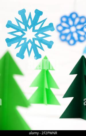 Origami Christmas trees of green craft paper isolated on white ...