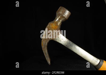 rusty hammer head with claw down isolated on a black background Stock ...