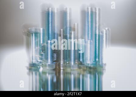 Bolts and nuts on a mirror background Stock Photo - Alamy