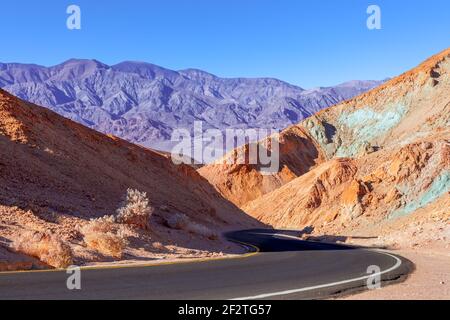 View of highway (Artists Dr.) crossing Death Valley National Park ...