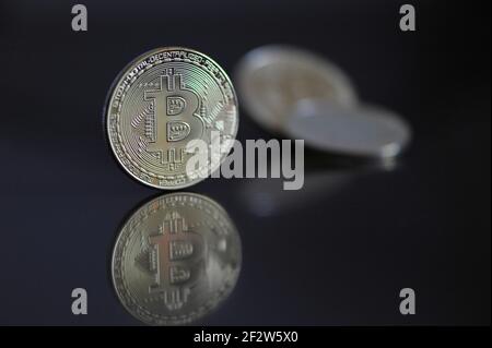 In this photo illustration, Bitcoins seen displayed. (Photo by Sheldon ...