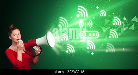 Young person with megaphone and technology related icon Stock Photo - Alamy