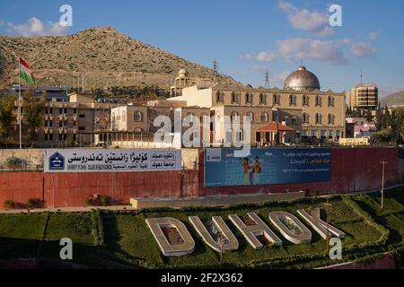 Duhok, Iraq. 13th Mar, 2021. A view of the houses inside the city built on the foot of a ...