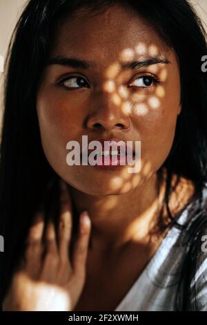 A gorgeous Hispanic woman in a white dress near the pool Stock Photo ...