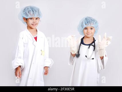 Children playing doctor and patient. Two little boys using stethoscope ...