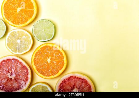Different fruits on bright color background Stock Photo - Alamy