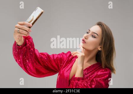 Photo of shiny positive young lady wear green sweatshirt typing modern ...